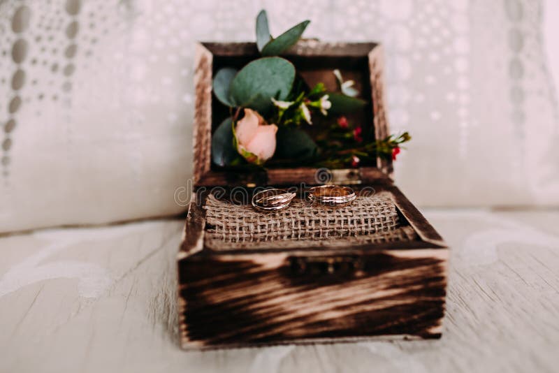 Golden Wedding Rings in the Beautiful Rustic Box with Flowers Inside ...