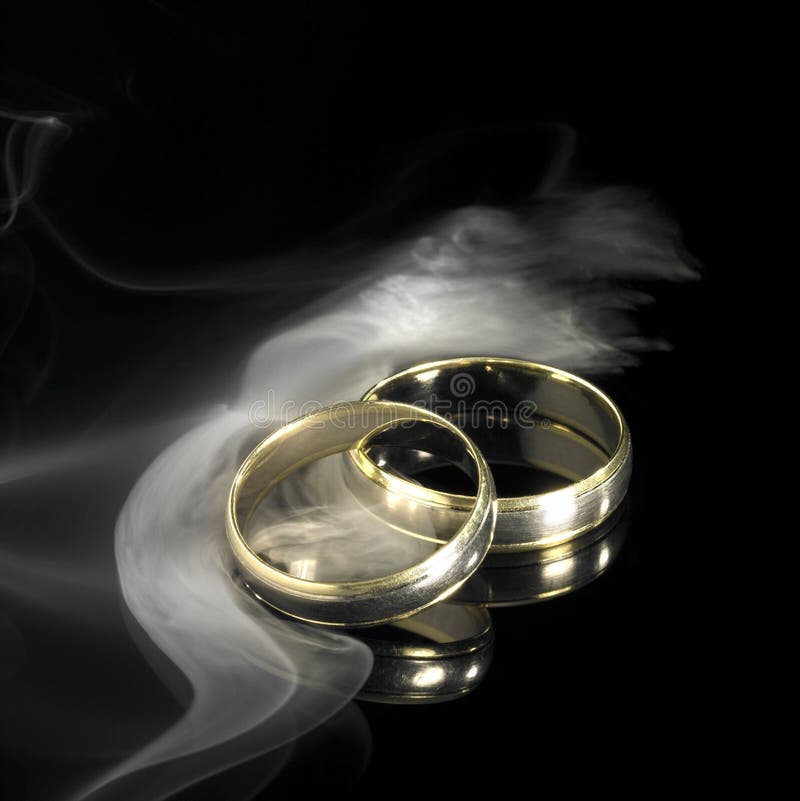 Golden Wedding Rings and Smoke Stock Photo - Image of spousal, married ...