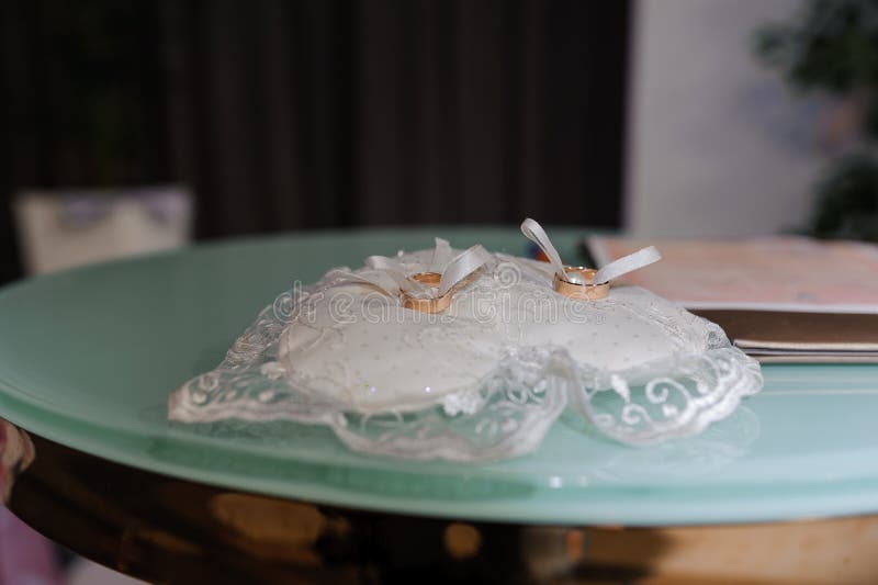 Golden Wedding Rings on a Stand on the Table. Wedding Ceremony Stock ...