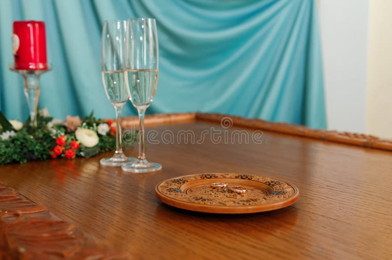 Golden Wedding Rings on a Stand on the Table. Wedding Ceremony Stock ...