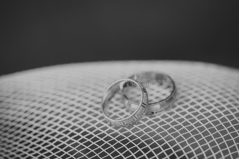 Golden Wedding Rings on the White Mesh Stock Image - Image of ...