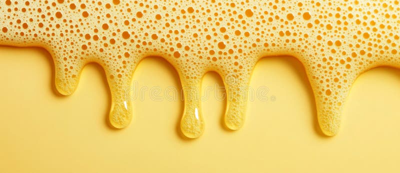 A Golden Yellow Liquid Flows Across a Background, Leaving Space for ...