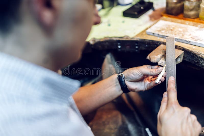 Goldsmith crafting jewels stock photo. Image of hand - 62442352