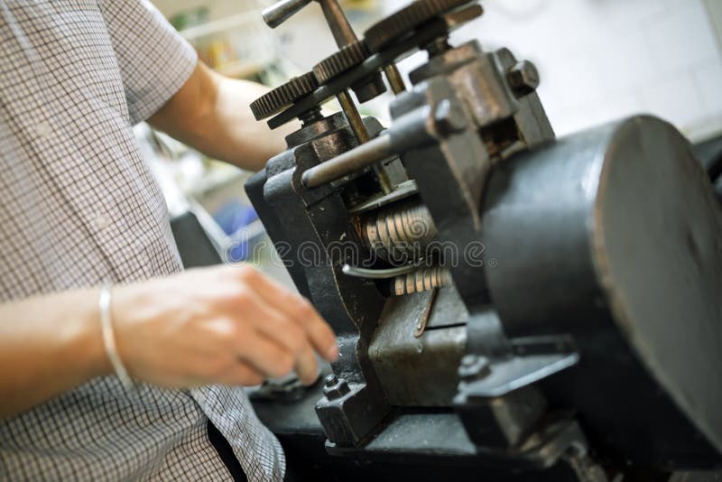 Goldsmith using machine stock photo. Image of finger - 64774832