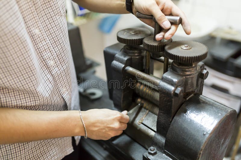 Goldsmith using machine stock image. Image of jeweler - 69869779