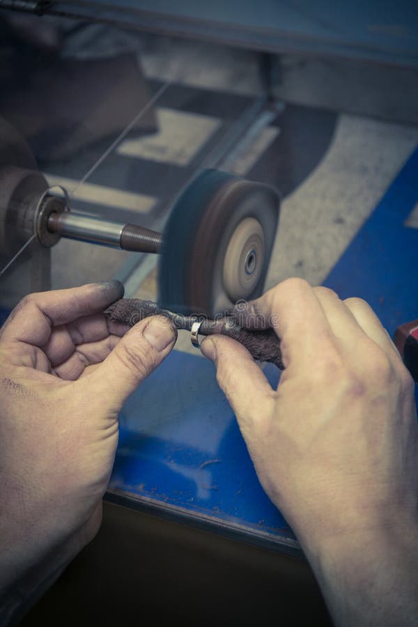 Goldsmith Working on Wedding Ring. Polishing Process. Stock Image ...