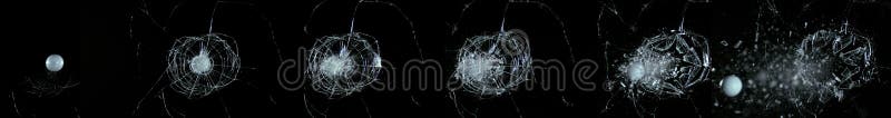 Golf Ball Breaking Pane of Glass Against Black Background Stock Photo ...