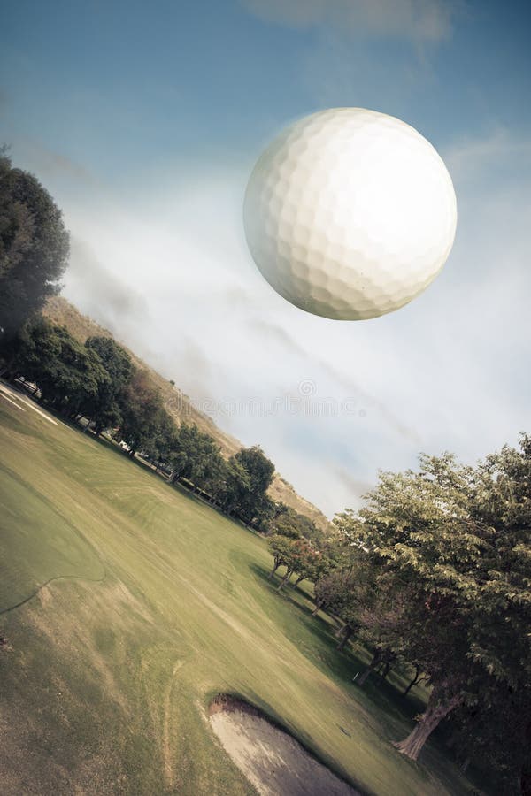 Golf Ball Flying Over a Green Field Stock Image - Image of power ...
