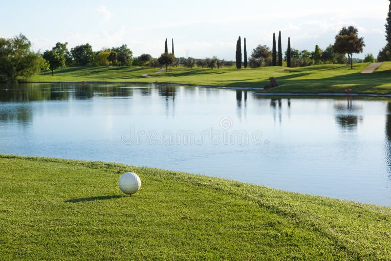 Golf Ball on the Green with Warm Tone and Sunset Stock Image - Image of ...