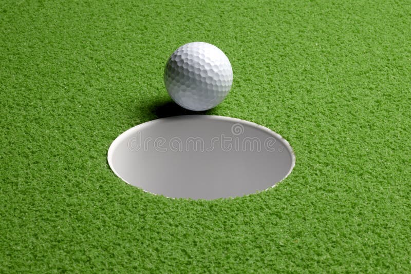 Golf ball at hole stock image. Image of success, edge - 18580937