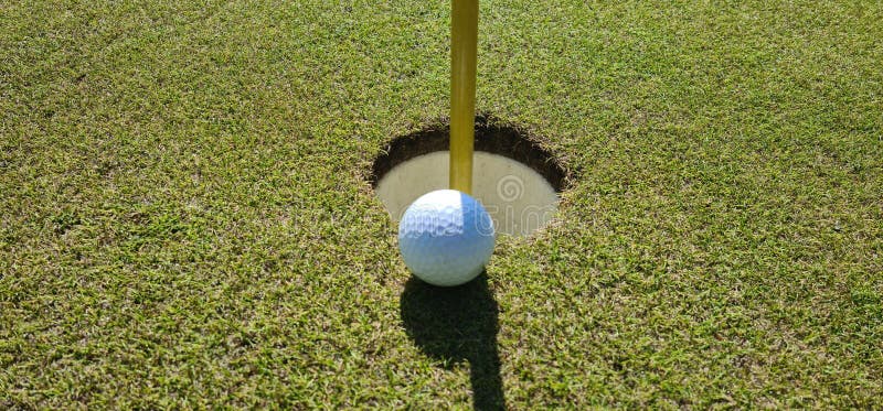 Golf Ball in the Hole Closeup. Golfing Stock Image - Image of concept ...