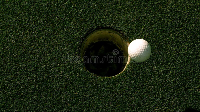 Golf Ball Rolling into the Hole on Putting Green Stock Video - Video of ...