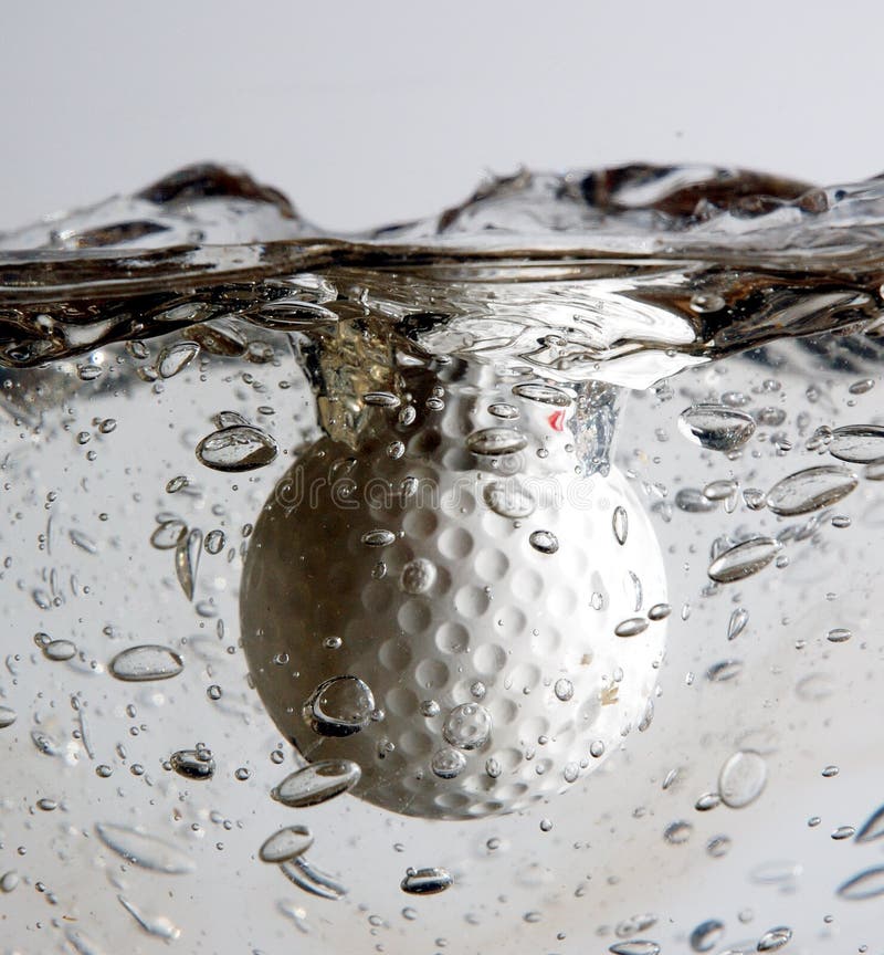 Splashing golf ball stock image. Image of dimple, bubbles - 15352603
