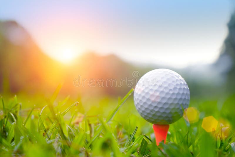 Golf Ball on Tee in Beautiful Golf Course with Sunset. Stock Photo ...