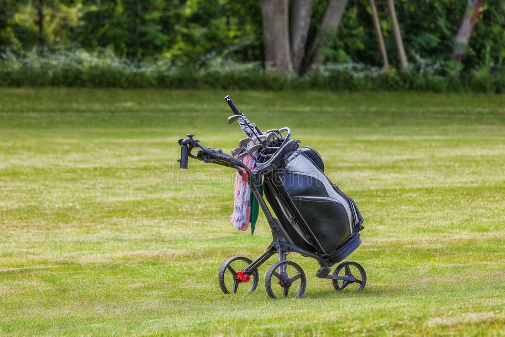 Golf Caddy on a Golf Course Stock Image - Image of hole, caddy: 183977519