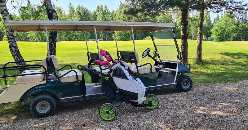 Golf Cart and Cart with Bag and Clubs on Golf Course Stock Image ...