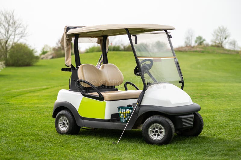 Golf Cart in Fairway of Golf Course with Green Grass Field with Sky ...