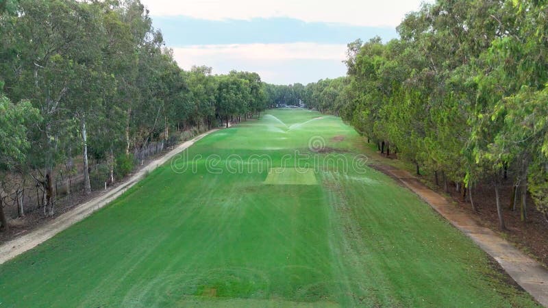 Golf Course Aerial View with Tree-lined Fairways and Serene Sunset ...