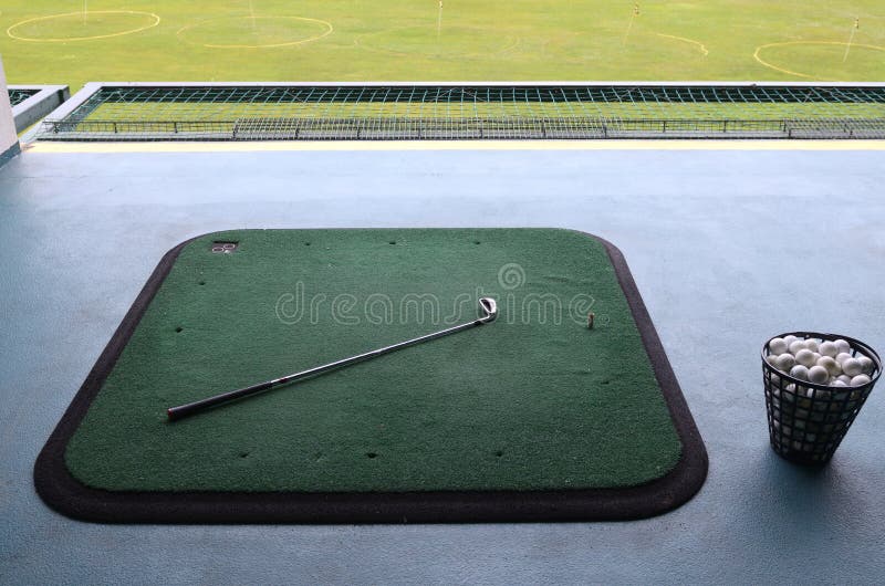 A Golf Course: Carpets, Golf Clubs and Baskets with Balls Stock Image ...