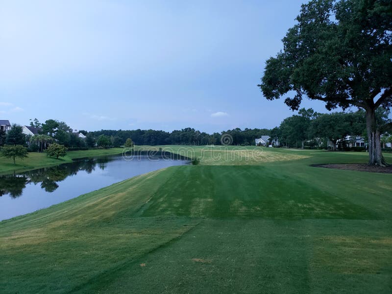 Golf Course at Dusk with Dark Sky Stock Image - Image of lagoon, dark ...