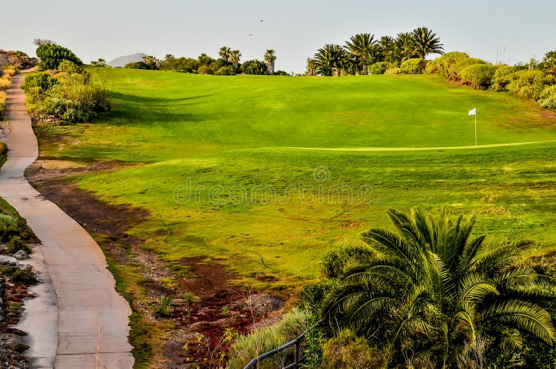 A Golf Course with a Green Hill and a Path Leading To it Stock Image ...