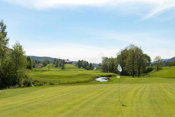 Golf Course. Hole with a White Flag on a Sunny Day Stock Image - Image ...