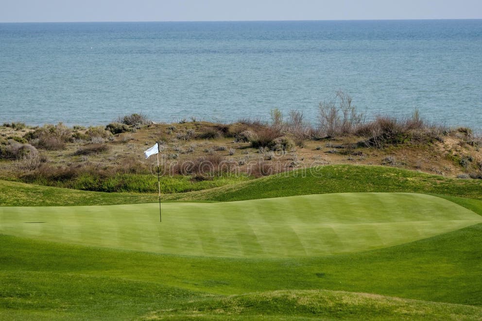A Golf Course and Its Flag Pole. Flag Pole on a Golf Green Stock Photo ...
