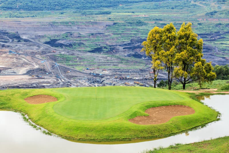 Golf Course in Open Pit stock photo. Image of cloudy - 34477146