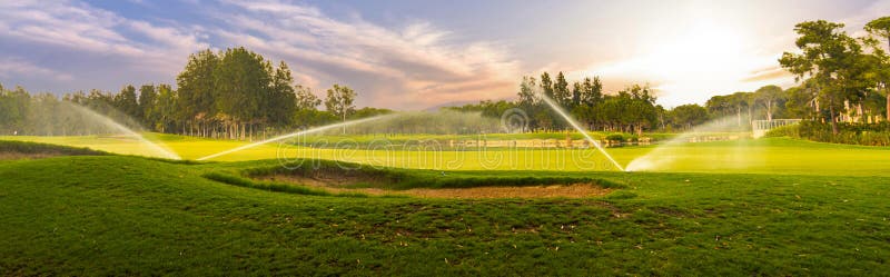 Golf Course in Maintenance. Watering Golf Course with Sprinklers. Golf ...