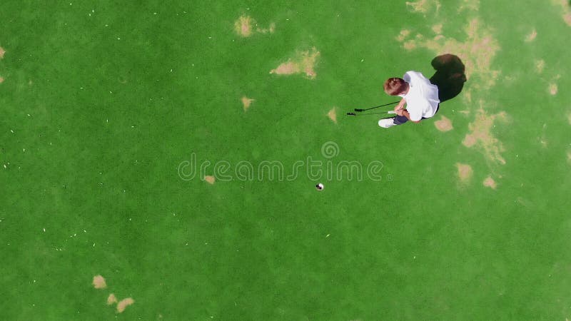 Golf Course with a Man Playing on it in a Top View Stock Footage ...