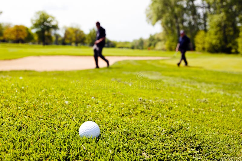Golf course with players stock photo. Image of players - 73787636
