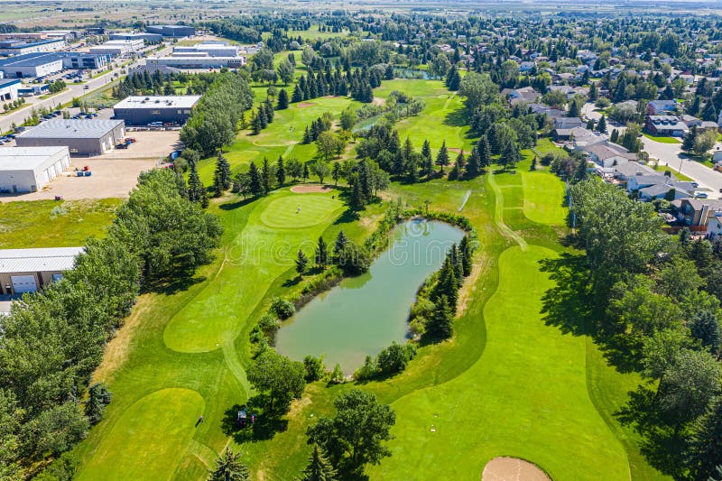Golf Course with a Pond in the Middle Stock Photo - Image of golfer ...