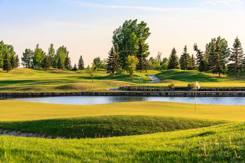 A Golf Course with a Pond in the Middle Stock Image - Image of pond ...