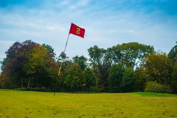 Golf Course with Red Flag stock photo. Image of golfing - 171871978