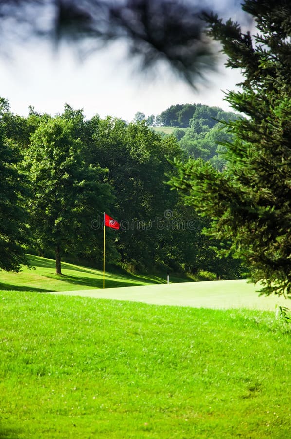 Golf Course with Red Flag in the Middle Stock Image - Image of empty ...