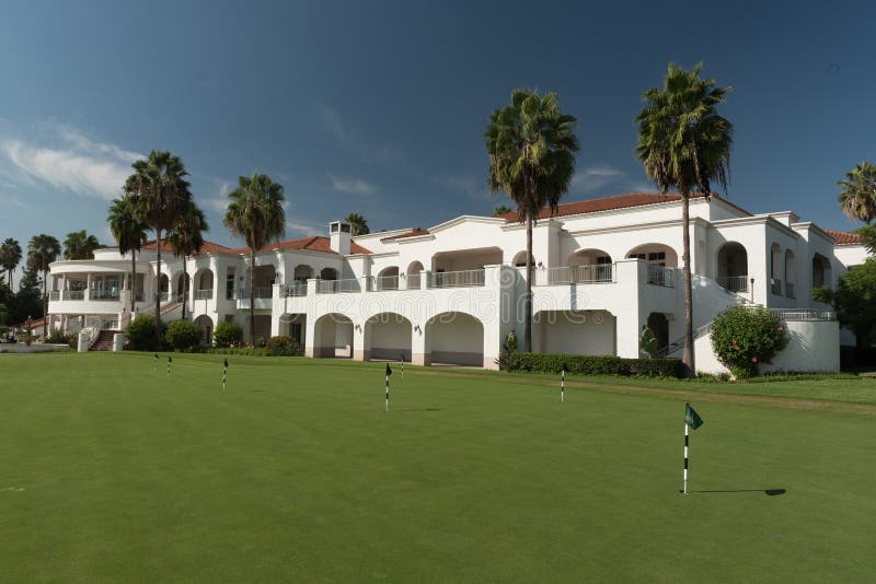 Golf Course at a Resort with Palm Trees Flanking the Building Stock ...