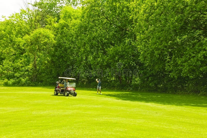 A Golf Course on a Sunny Day Editorial Stock Photo - Image of person ...