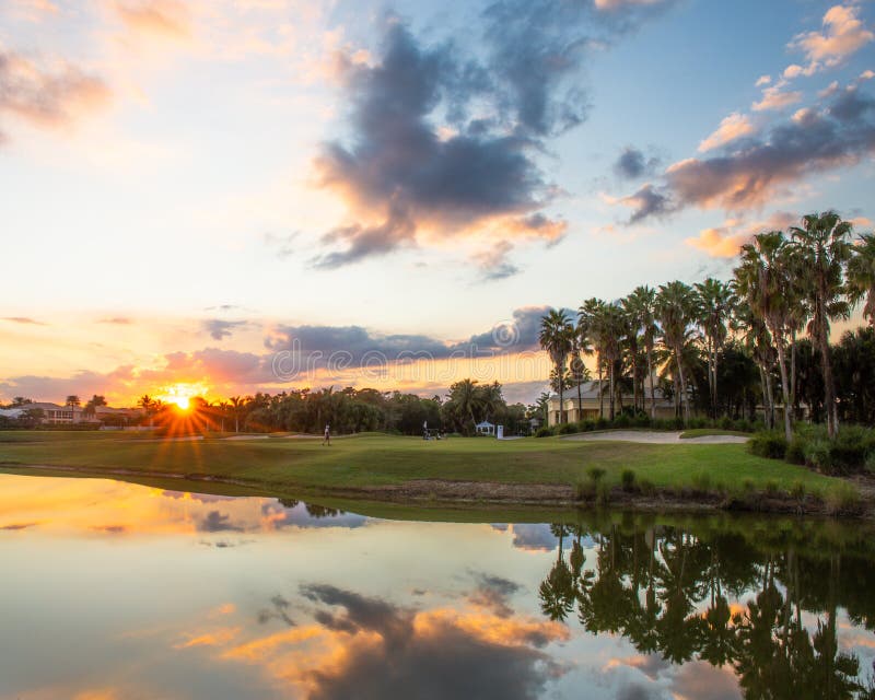 Golf Course Sunset with Sprinklers in the Sunset Stock Photo - Image of ...