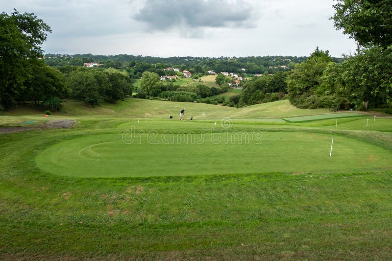 Tranquility on the Golf Course: a Golfer Practices His Swing on a ...