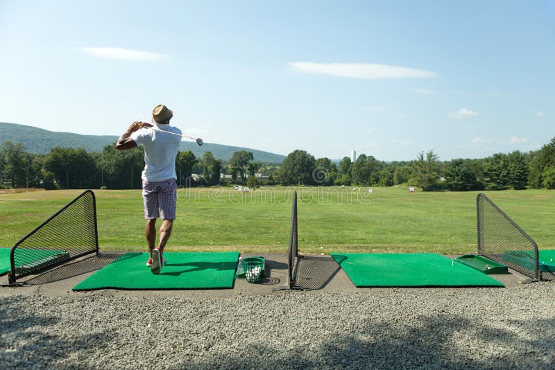 Golf at the Driving Range stock photo. Image of american - 54913368