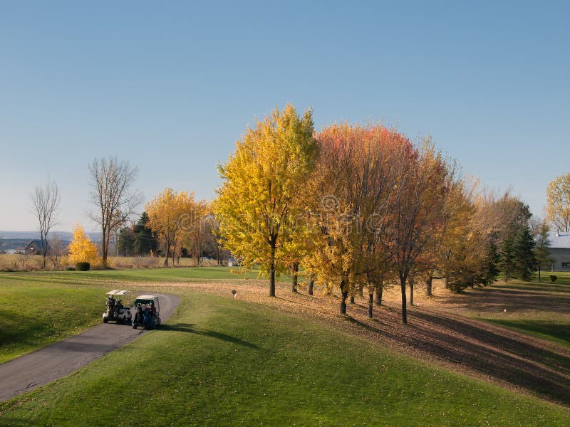 Golf in Fall with Men Driving Carts Stock Photo - Image of autumn ...