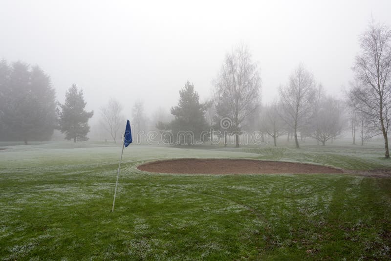 Golf flag and bunker stock image. Image of foggy, outside - 71973011