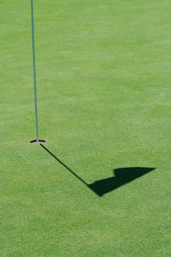 Golf green flag shadow stock image. Image of grass, hole - 7263309