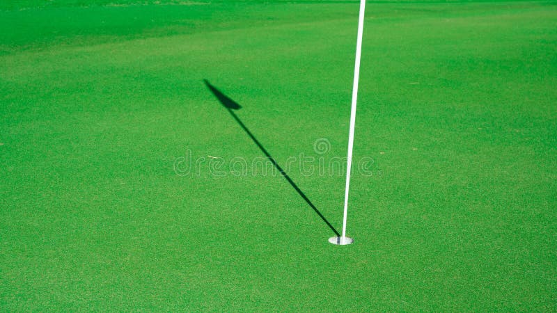 Golf Hole with the Shadow of the Flag Stock Image - Image of header ...