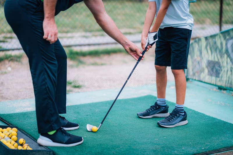 Golf Lessons. Golf Instructor Giving Game Lesson To a Young Boy Stock ...