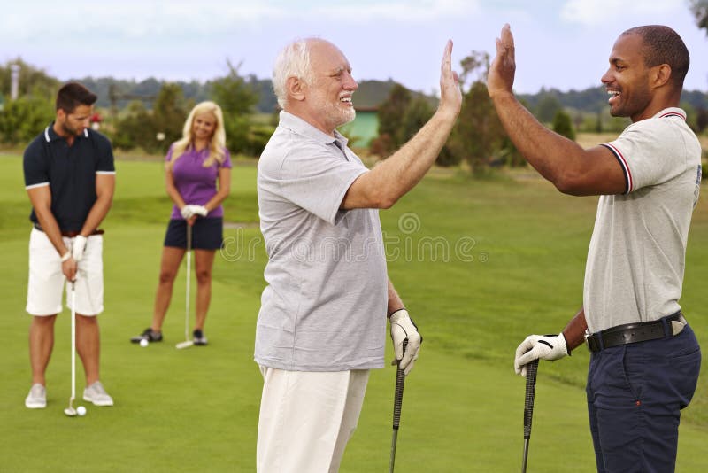 Mature couple playing golf stock photo. Image of recreation - 19404408