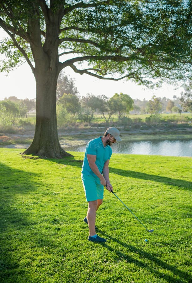 Golf Player Playing Golf on Sunny Day. Golfer Taking Shot on Golf ...