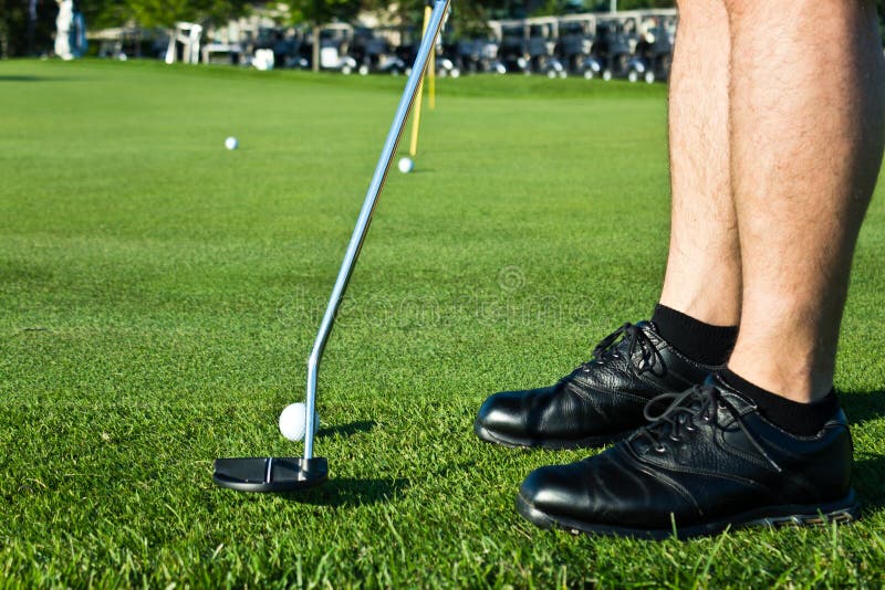 Golfer Practicing Putting with Several Golf Balls Stock Photo - Image ...
