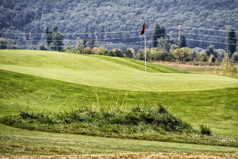 Golf Playground Hills with Flag by the Hole Stock Image - Image of lawn ...
