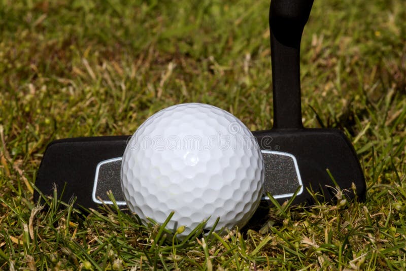 Golf Putter and Golf Ball on a Golf Course Stock Photo - Image of black ...